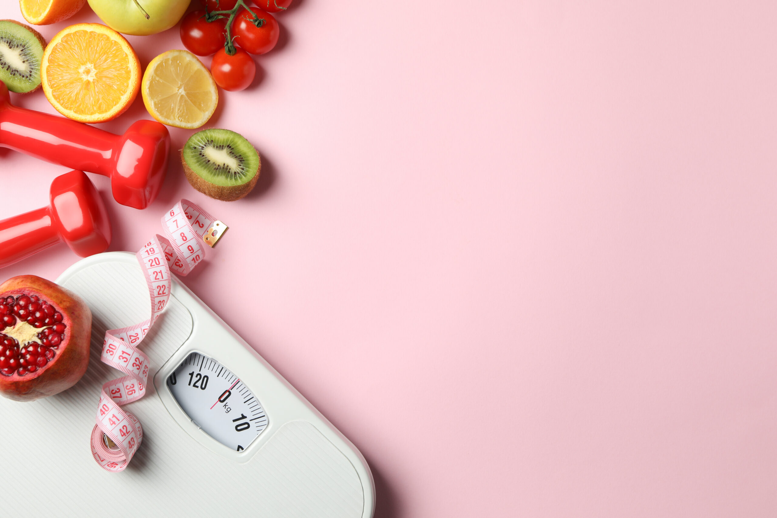 Weight loss or healthy lifestyle accessories on pink background ...